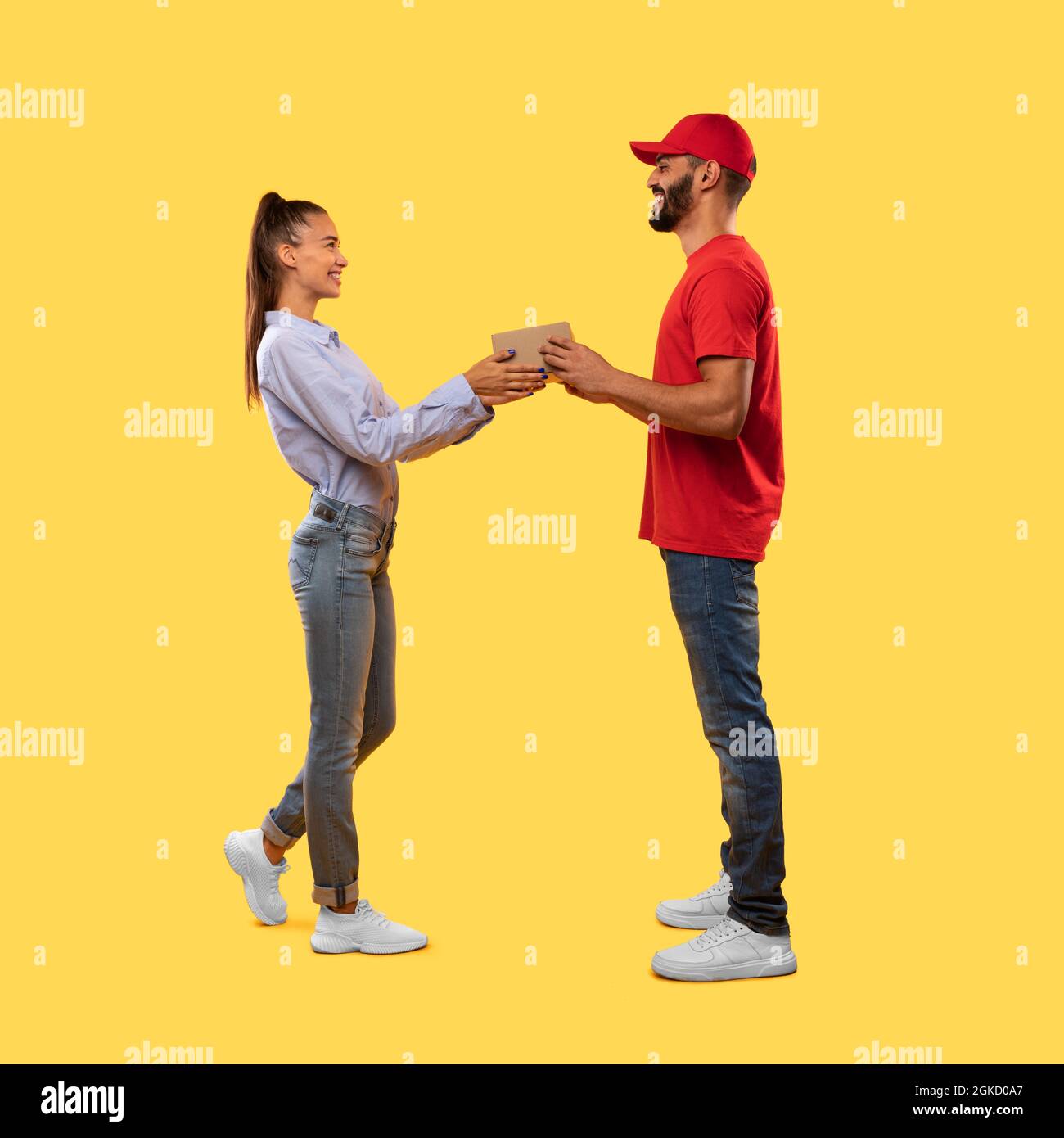 Arabic Courier Man Giving Boxes Delivering Parcel To Customer, Studio ...