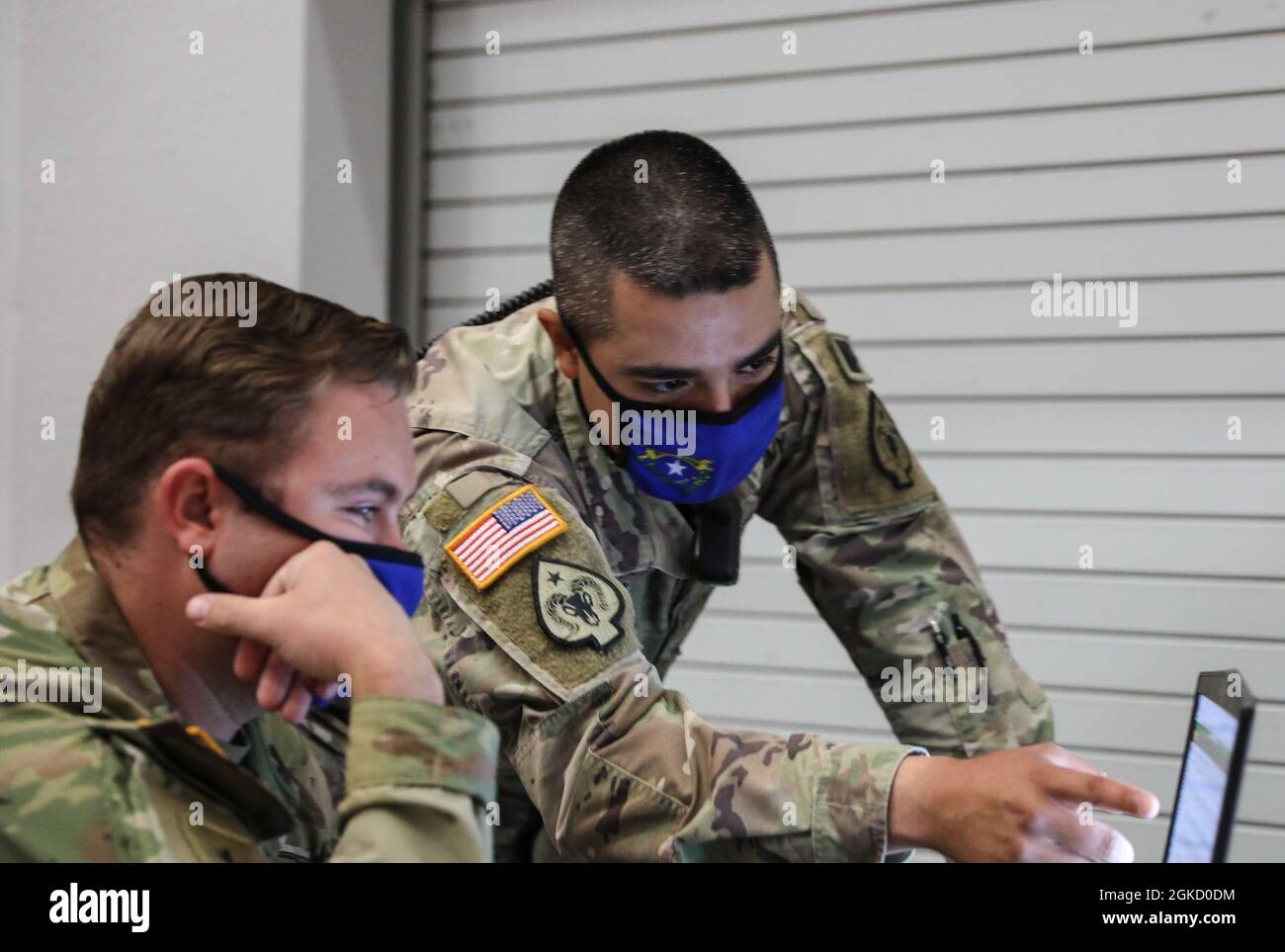 Sgt. John Huss with Joint Task Force 17 discusses operations with Spc ...