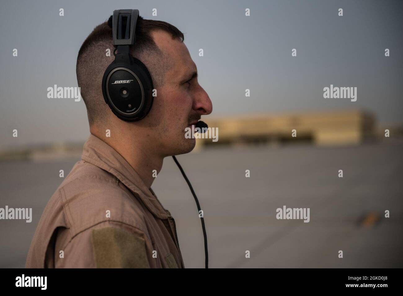 A U.S. Air Force loadmaster watches as the engines start up on a C-130 ...