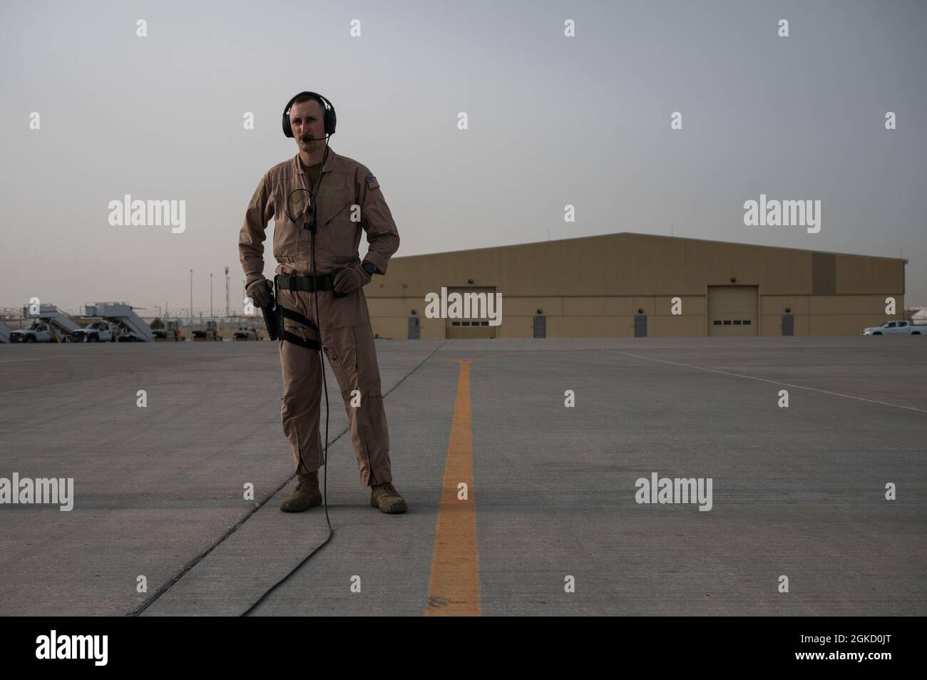 A U.S. Air Force loadmaster watches as the engines start up on a C-130 ...
