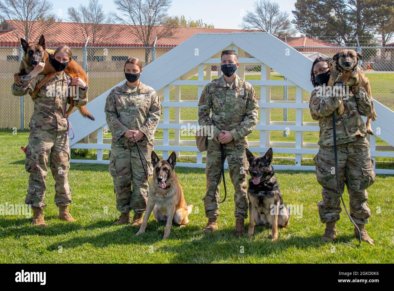 From left to right, military working dog Aarapaho, U.S. Air Force Staff ...