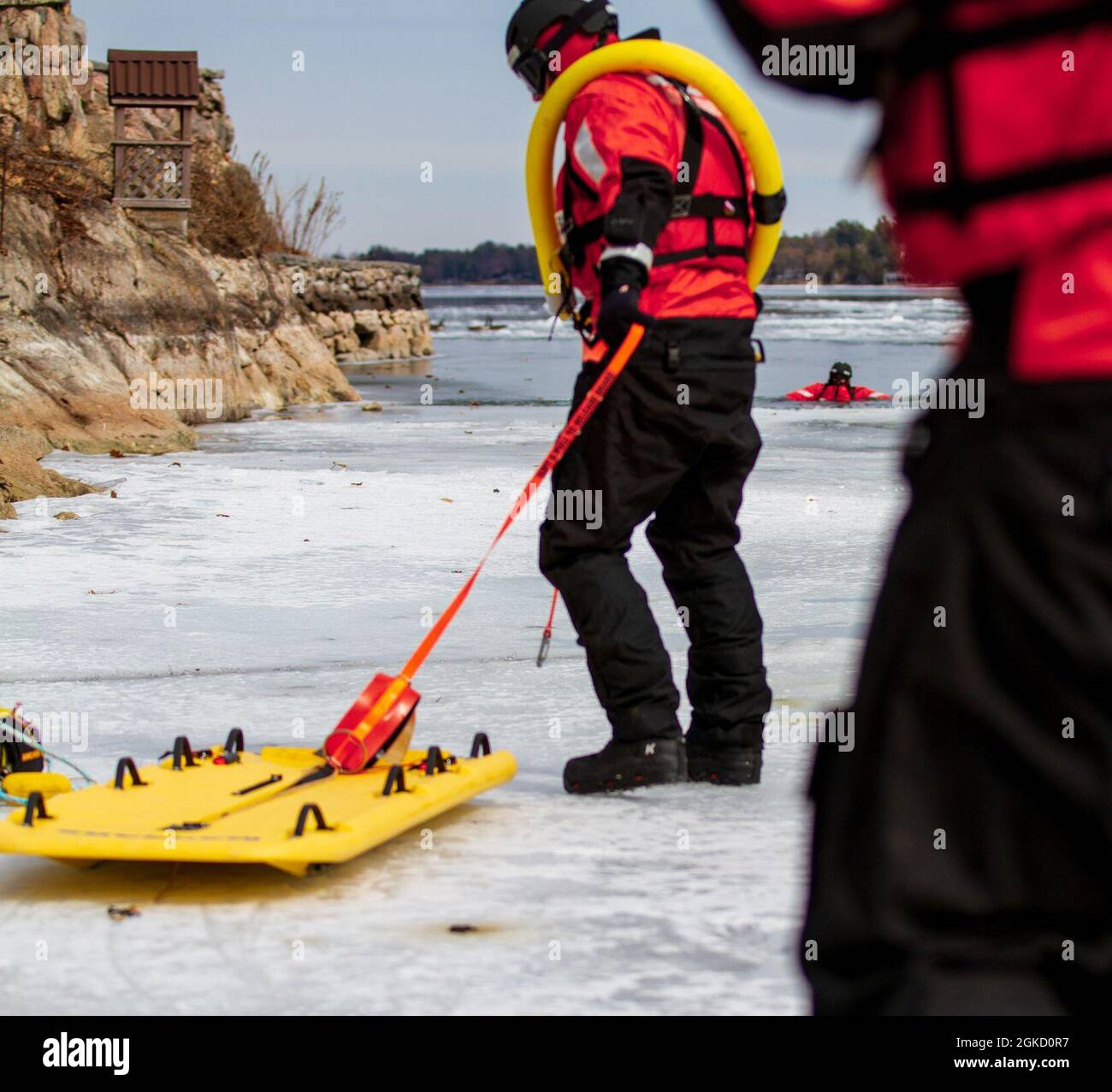 Members of the Coast Guard approach a simulated survivor in the water ...