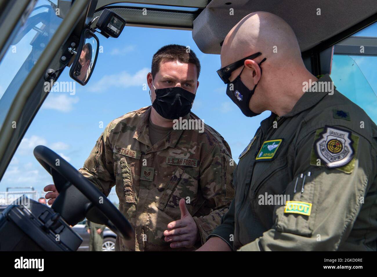 Lt. Col. Andrew Miller, 61st Airlift Squadron commander, receives ...