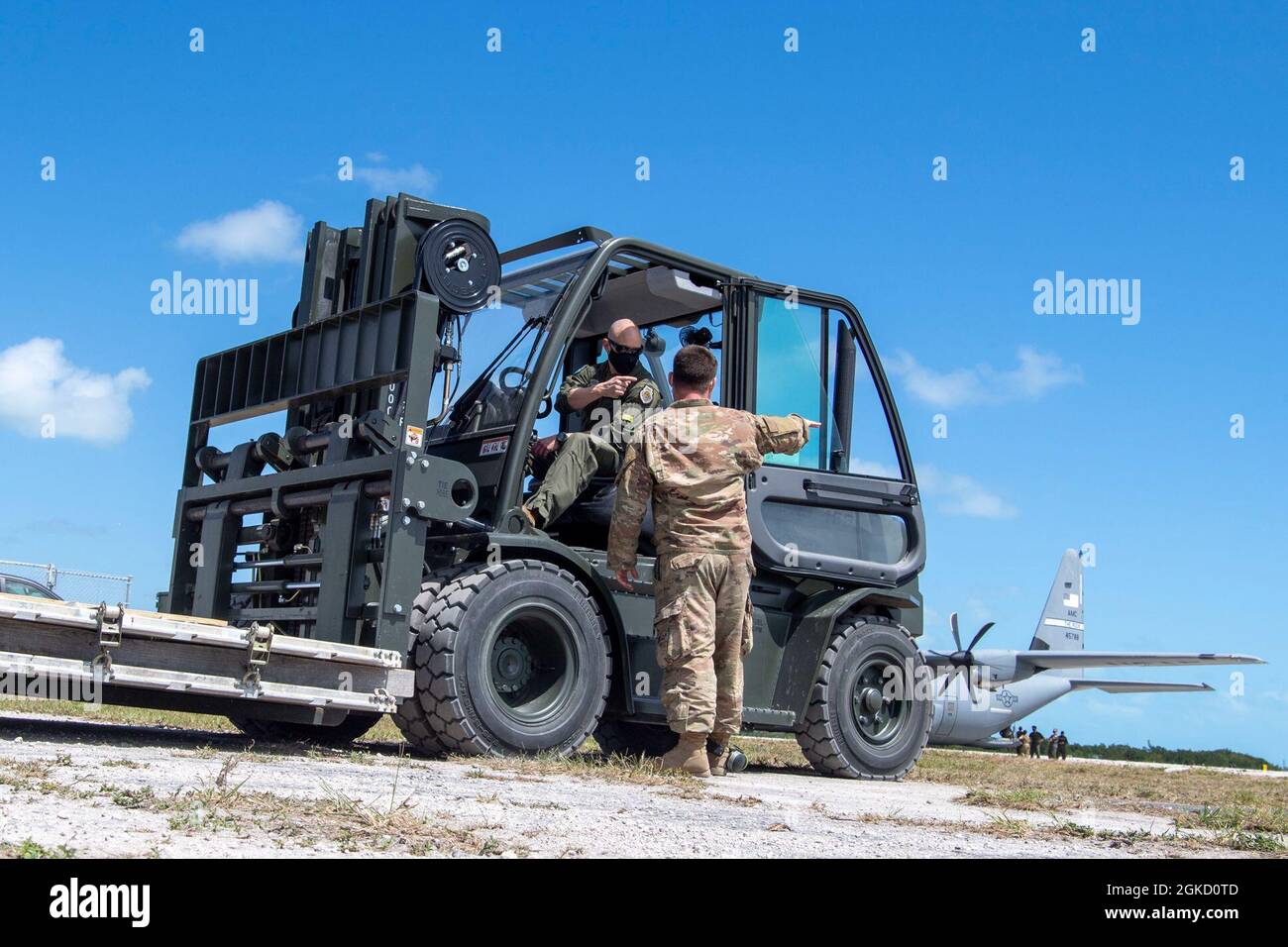 Lt. Col. Andrew Miller, 61st Airlift Squadron commander, receives ...