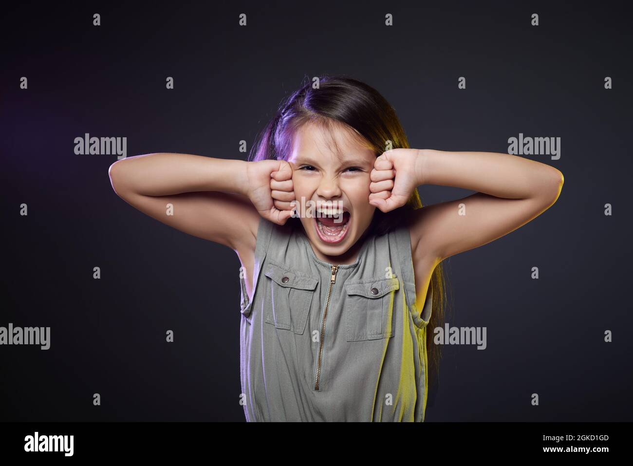 child girl screaming on the dark background Stock Photo - Alamy