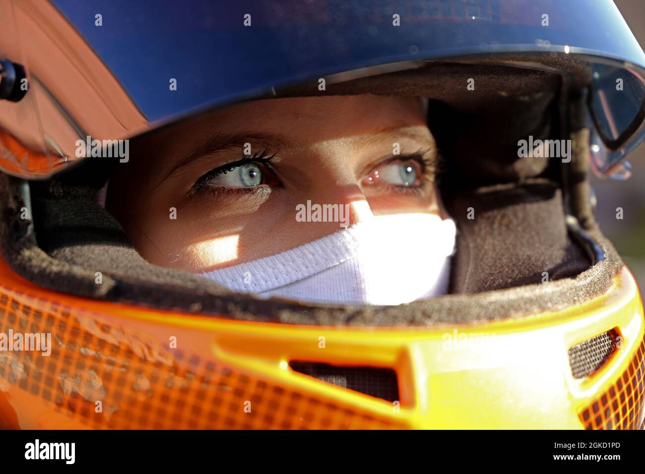 Symbol image: Female race car driver wears helmet and balaclava (Model ...