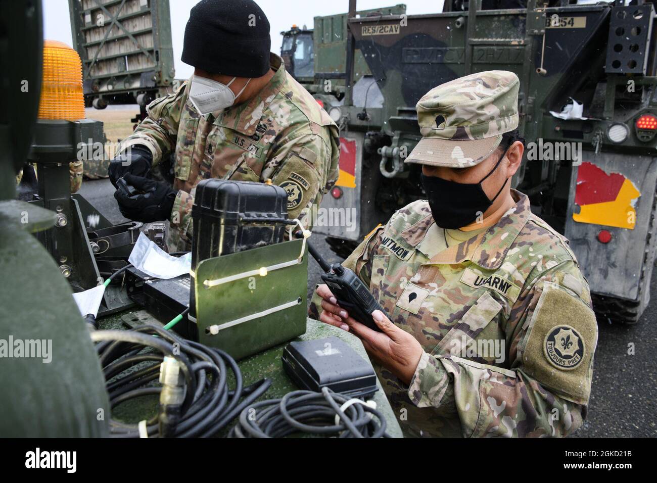 U.S. Army Spc. Teresita Mitnow, right, and U.S. Army Sgt. 1st Class ...