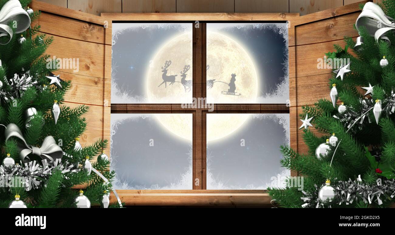 Digital image of two christmas tree and wooden window frame Stock Photo ...