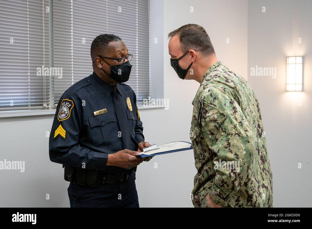 WASHINGTON, DC (March 17, 2021) – Capt. Grahame Dicks (right), Naval ...