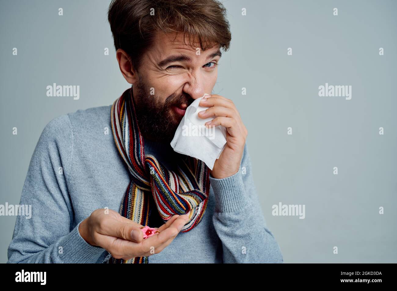 cold man with a scarf around his neck flu health problems light ...