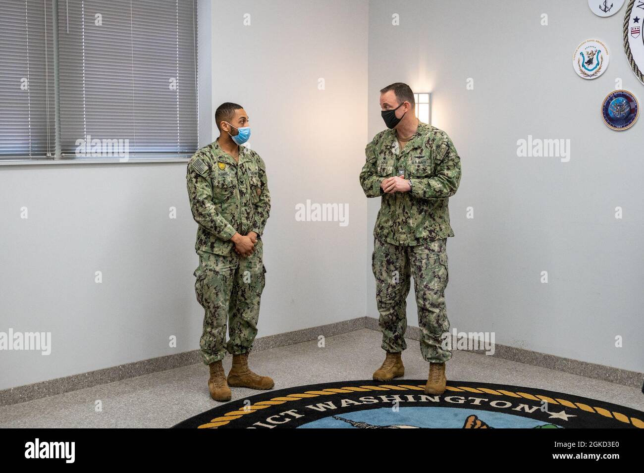 WASHINGTON, DC (March 17, 2021) – Capt. Grahame Dicks (right), Naval ...