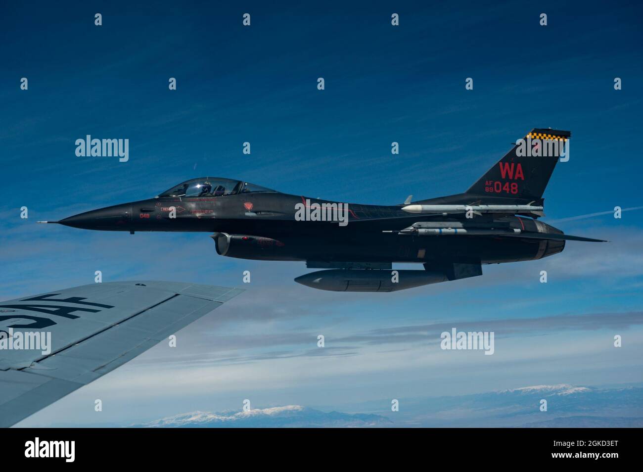 A pilot assigned to the 64th Aggressors Squadron flies an F-16 Fighting ...