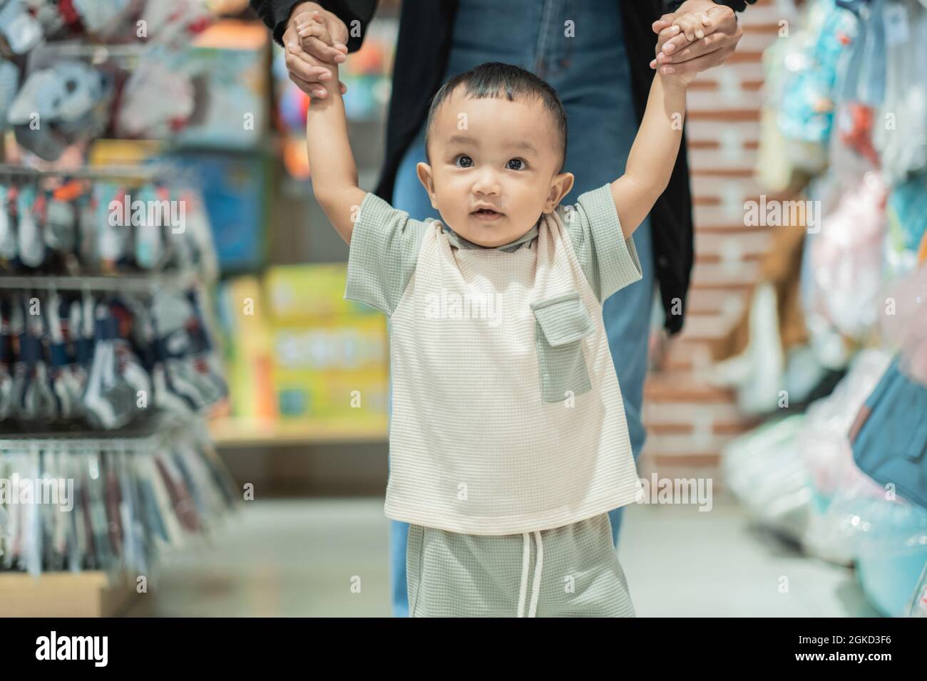boy learn to walk while shopping in baby store Stock Photo - Alamy