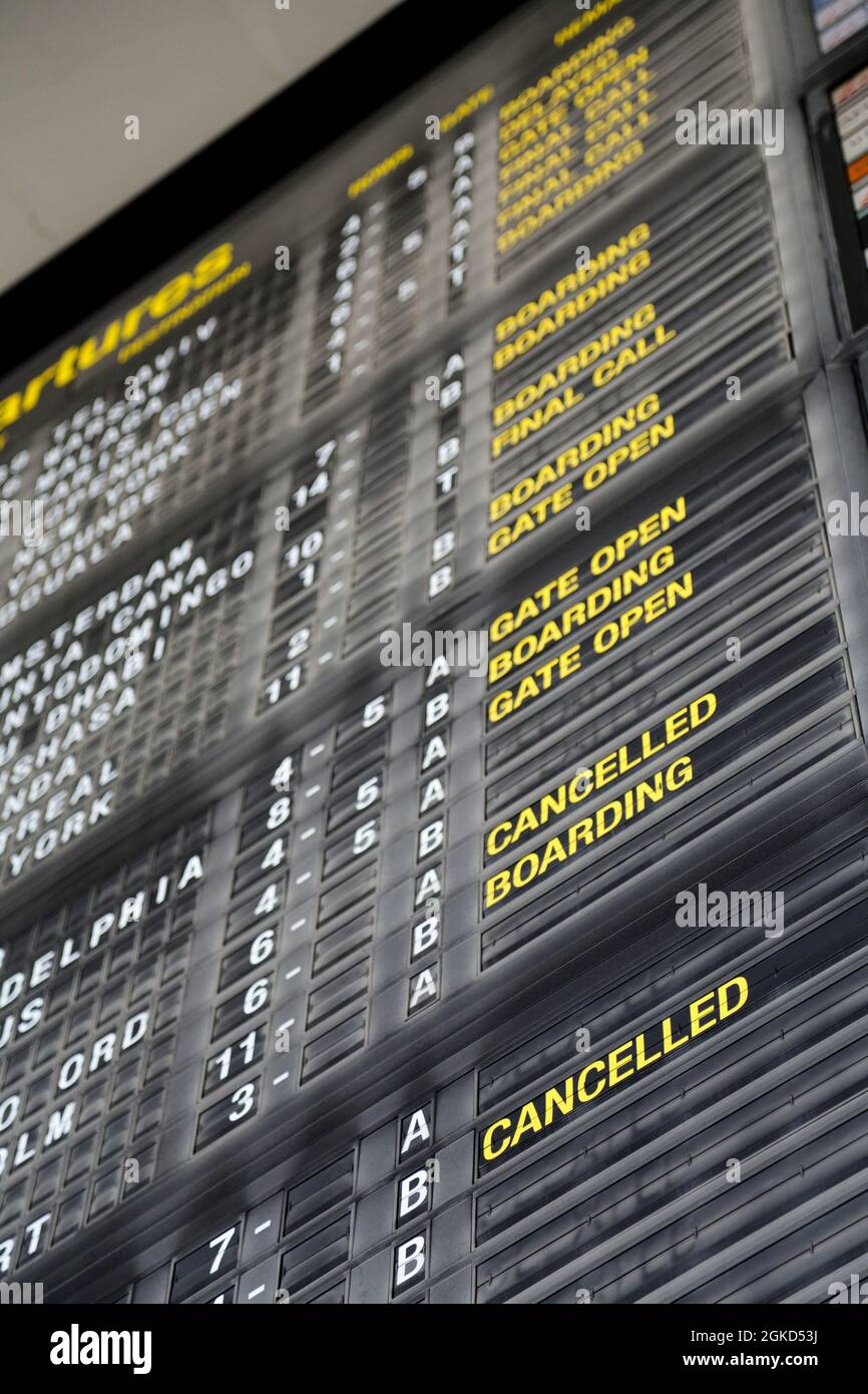 Airport departure board in terminal with flight information Stock Photo ...