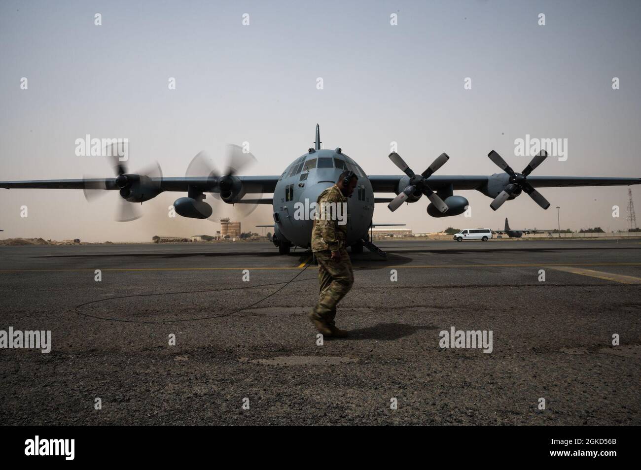 A U.S. Air Force loadmaster watches as the engines start up on a C-130 ...