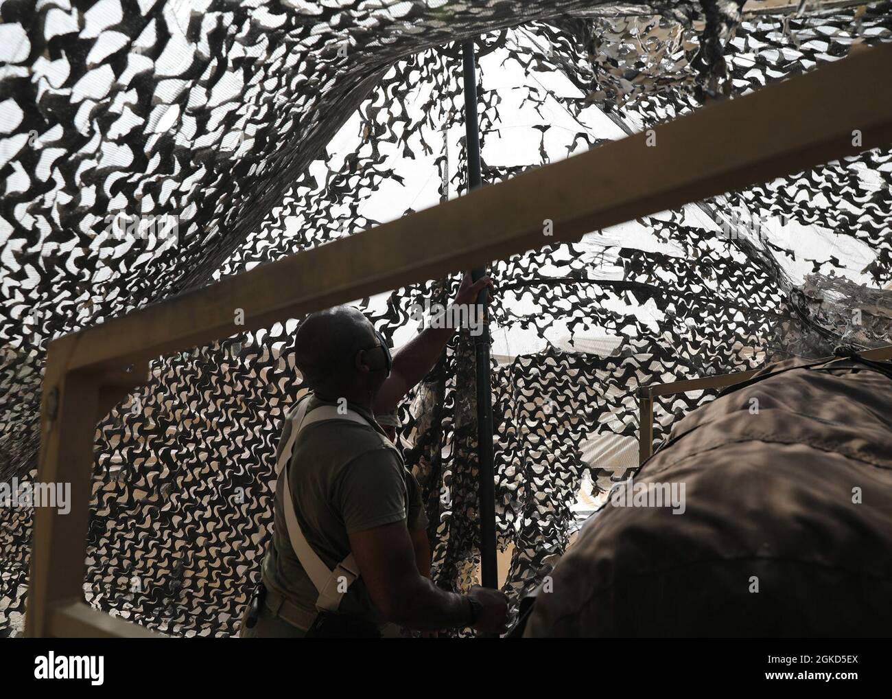 Army Reserve Maj. Jesse Thomas, deployed to Camp Arifjan, Kuwait, with ...