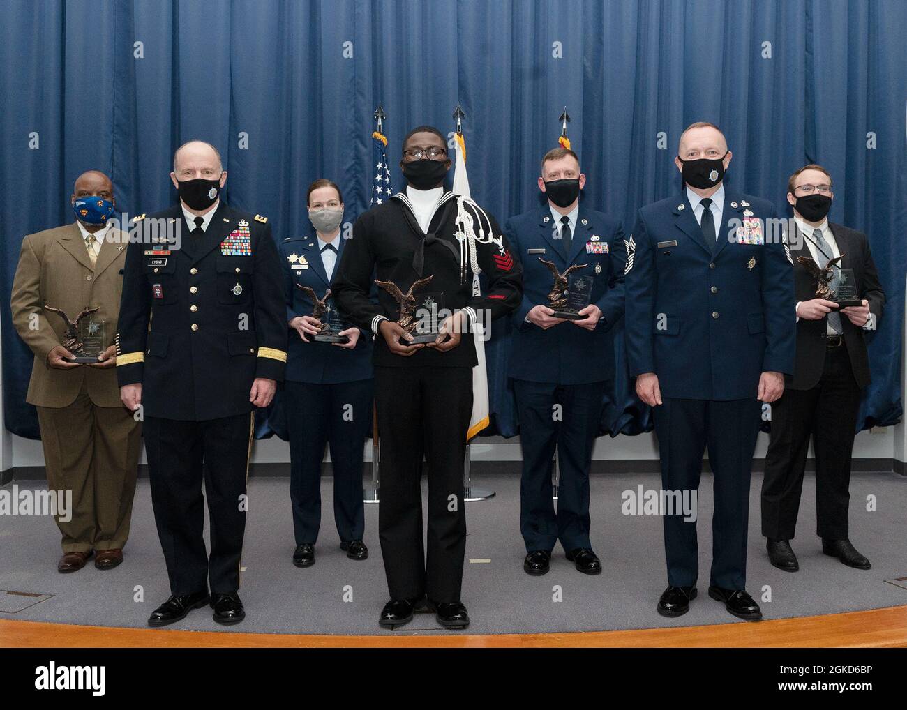 U.S. Transportation Command Annual Awards winners pose on stage during ...