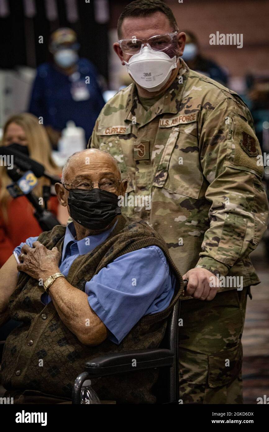 U.S. Army Korean War veteran James Plummer, 90, is assisted by Senior ...