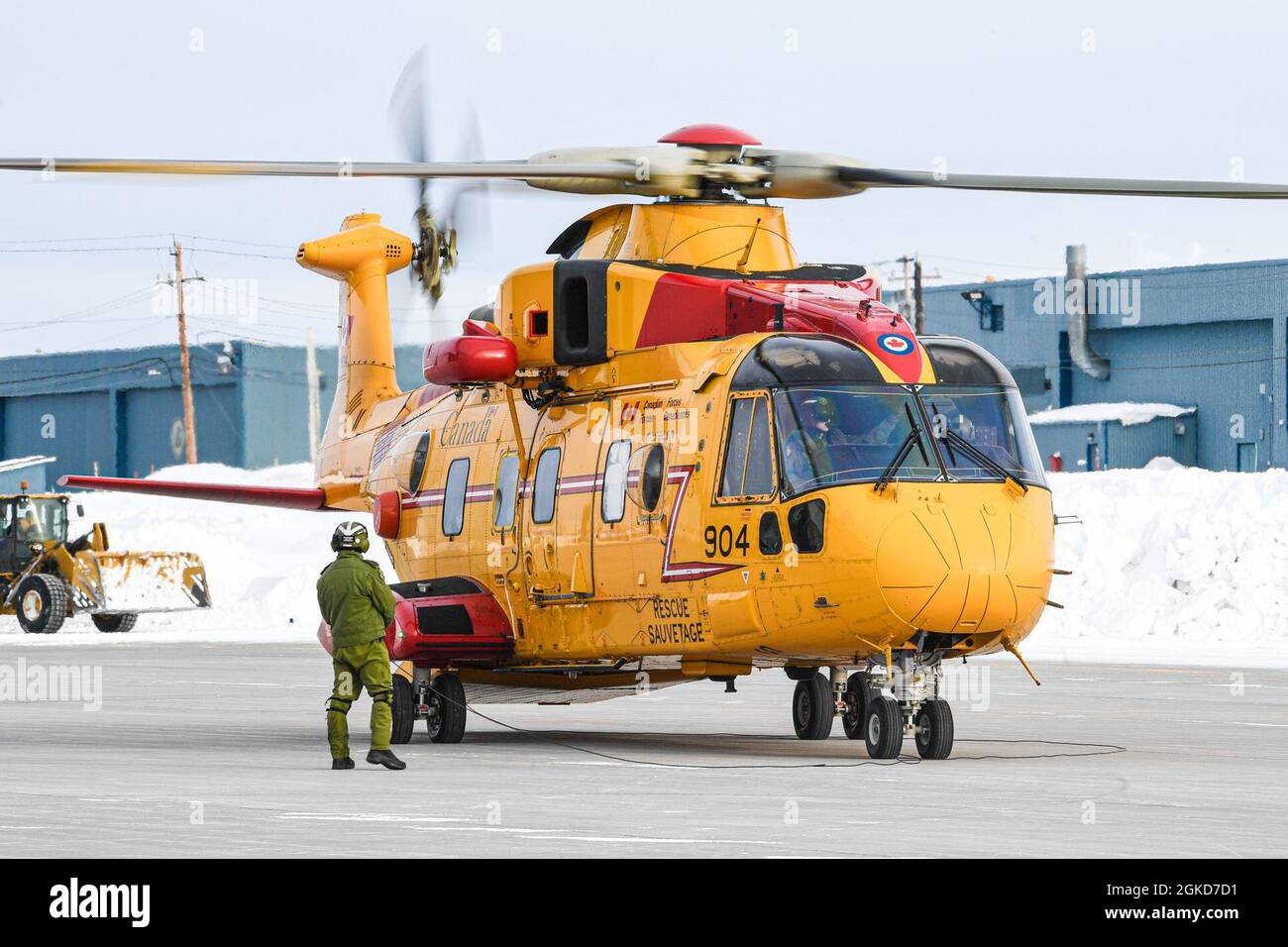 Flight Crew from 103 Search and Rescue Squadron, prepare a CH-149 Cormorant for a flight from 5 ...