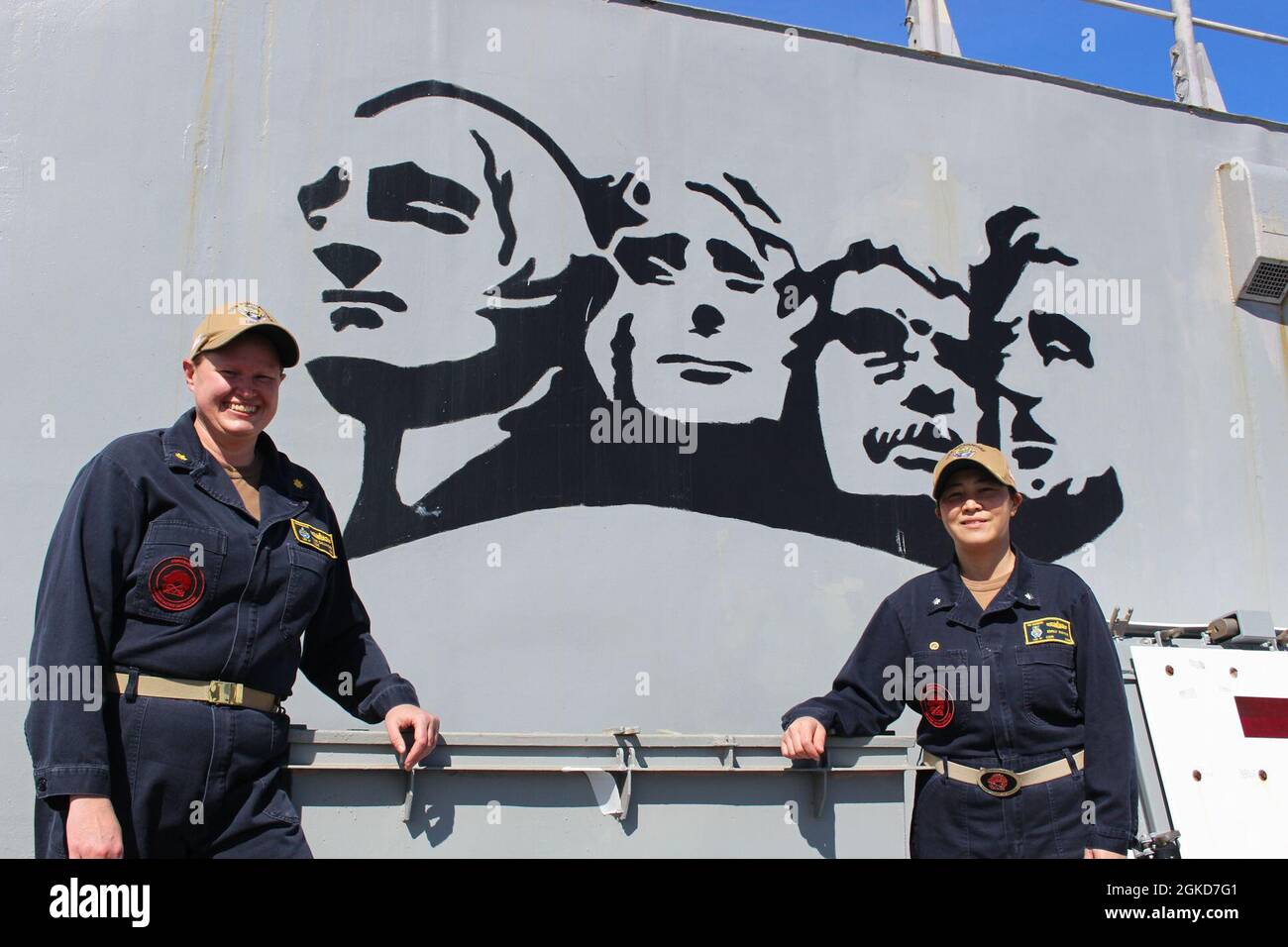Whidbey Island-class dock landing ship USS Rushmore (LSD 47) is led by ...
