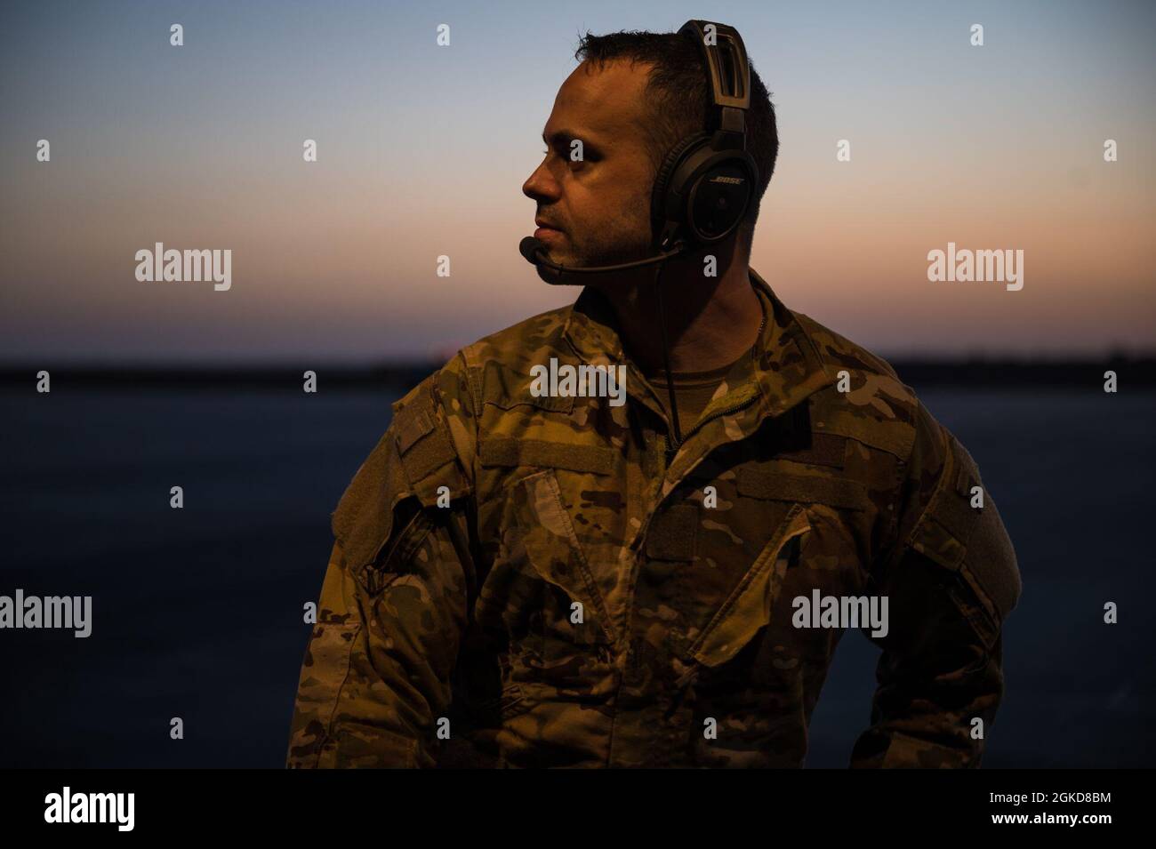 A U.S. Air Force loadmaster watches as the last of a C-130 Hercules ...