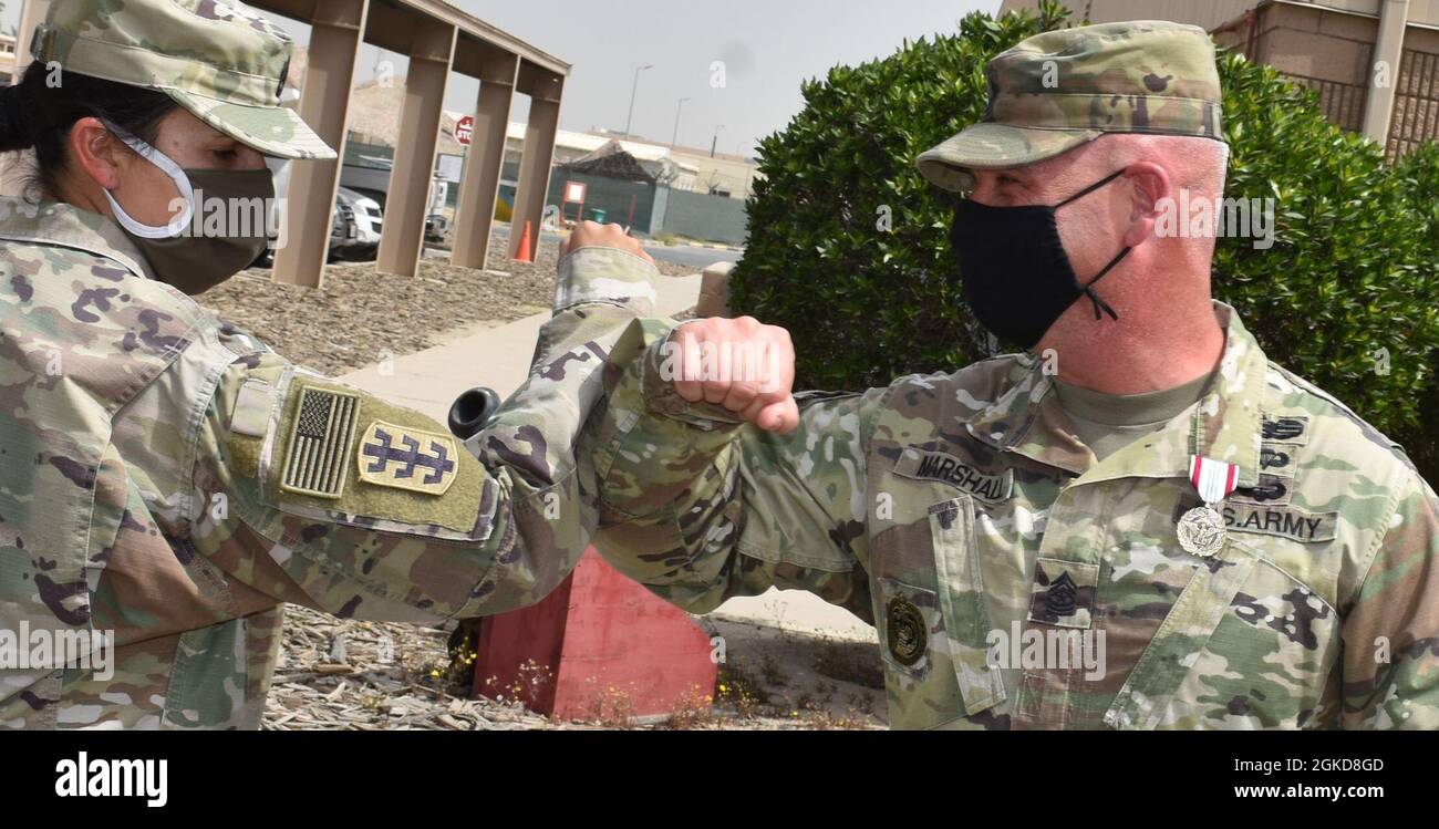 Sergeant First Class Cristin Baughman gets a final elbow bump in to ...