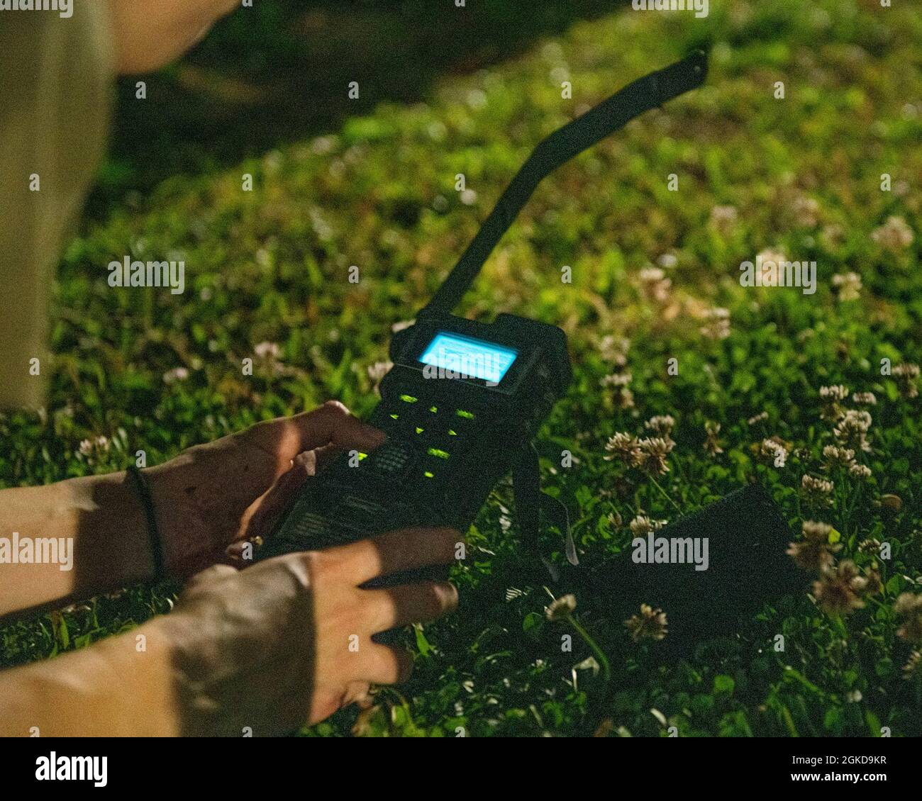 A U.S. Air Force aircrew member uses a combat survivor evader locator ...