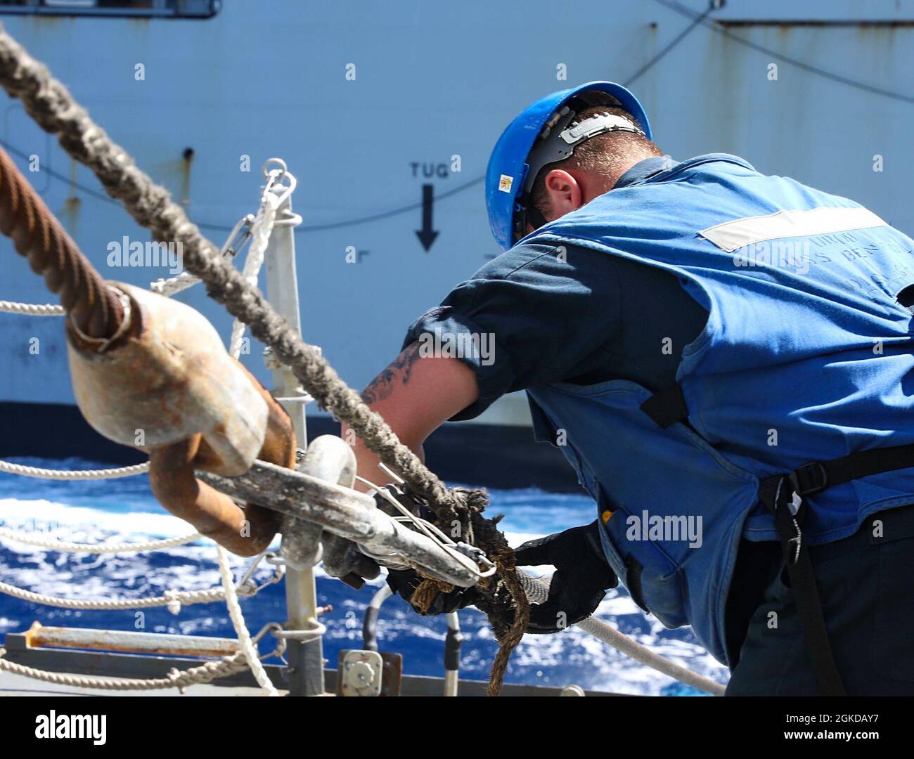 Boatswain’s Mate Seaman Jason Farris, from Sparta, Tenn., connects a ...