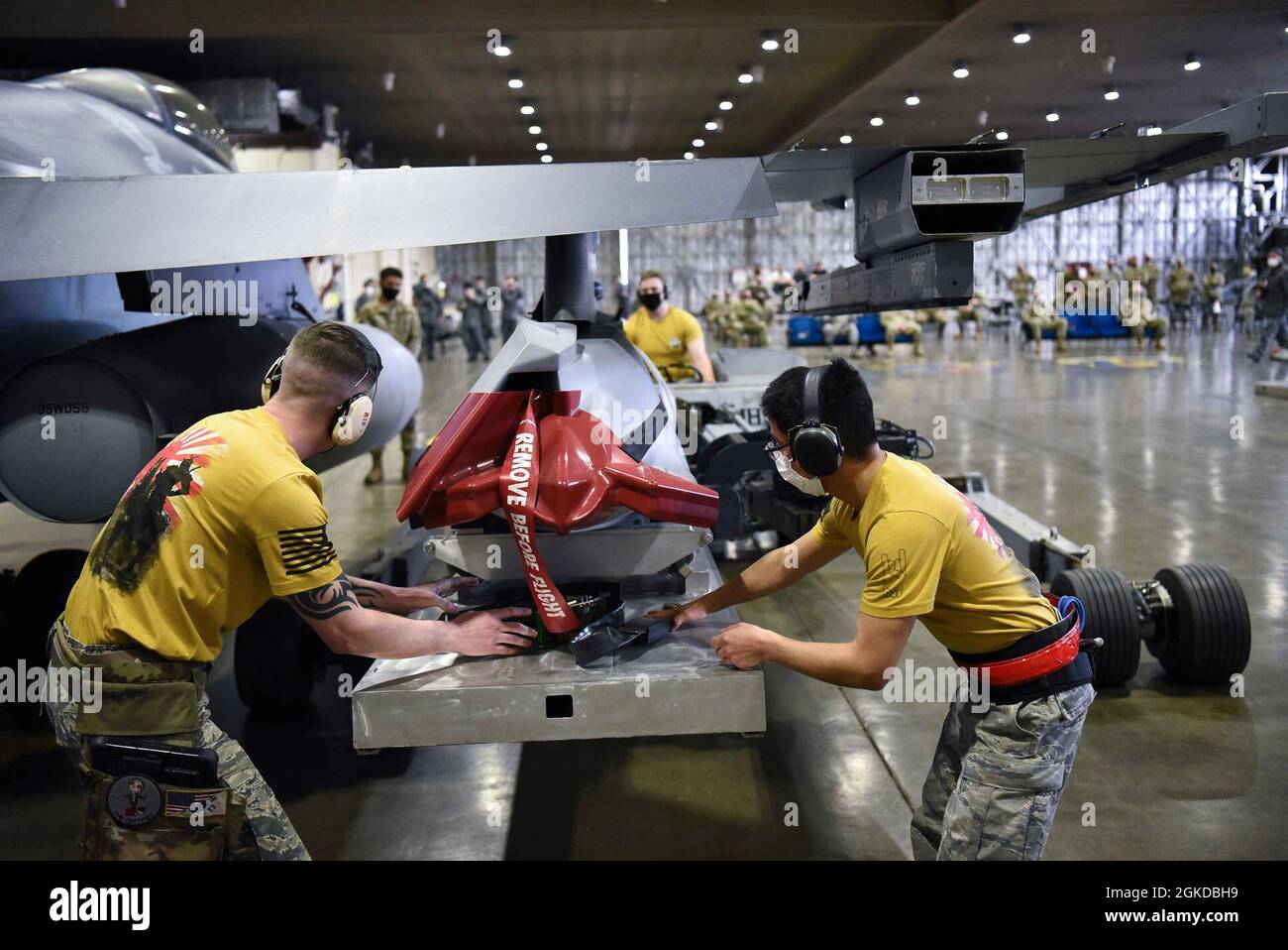 U.S. Air Force Staff Sgt. Kevin Myers, left, a weapons load team chief ...