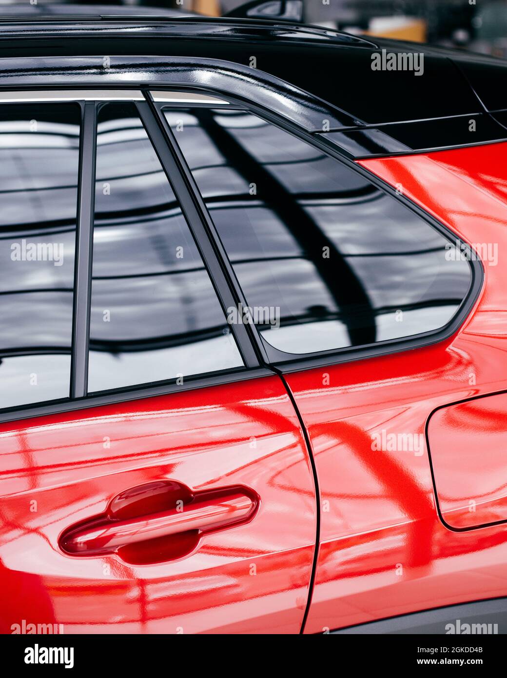 Side view of turning luxury red car Stock Photo - Alamy