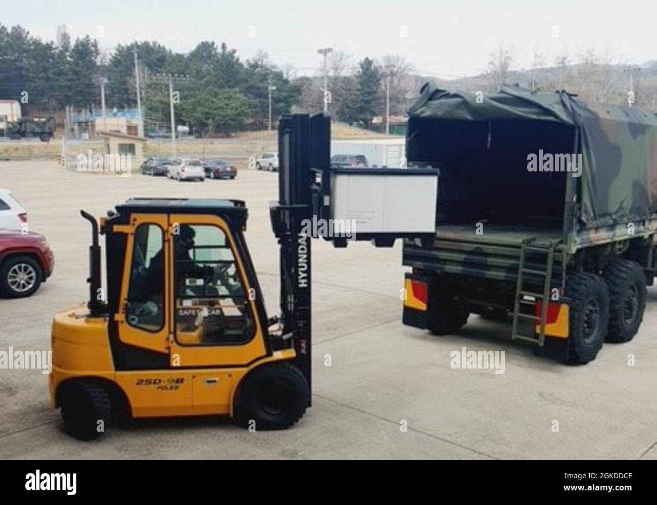 A Soldier with the 563rd Medical Logistics Company loads a tactical ...