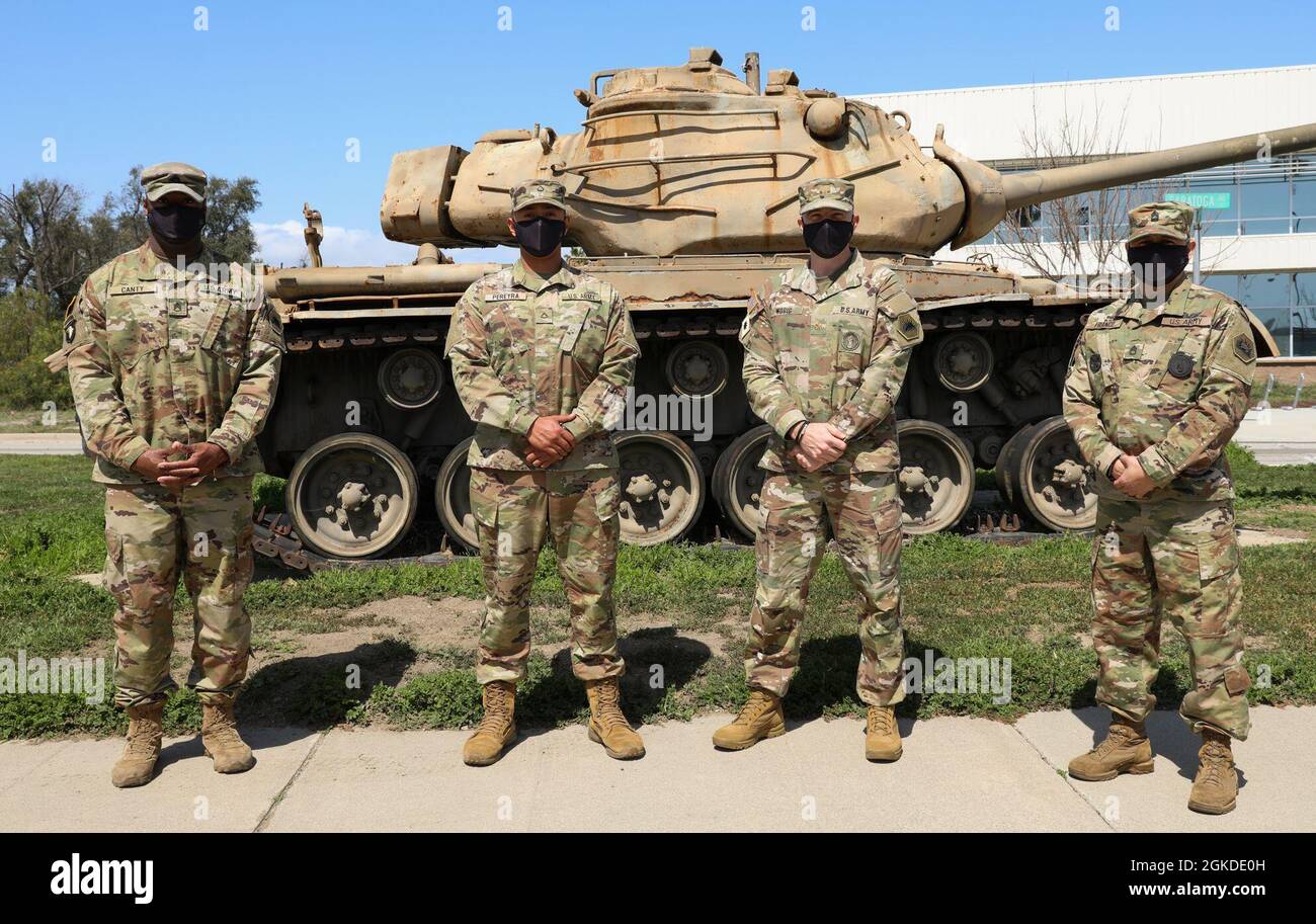 U.S. Army Pfc. Enrique Pereyra stands proudly alongside leaders of the ...
