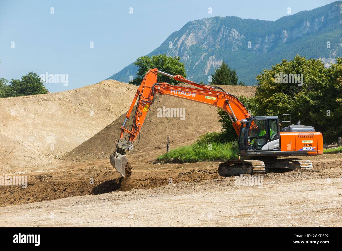 Hitachi digger / heavy plant machinery working on a site, building ...