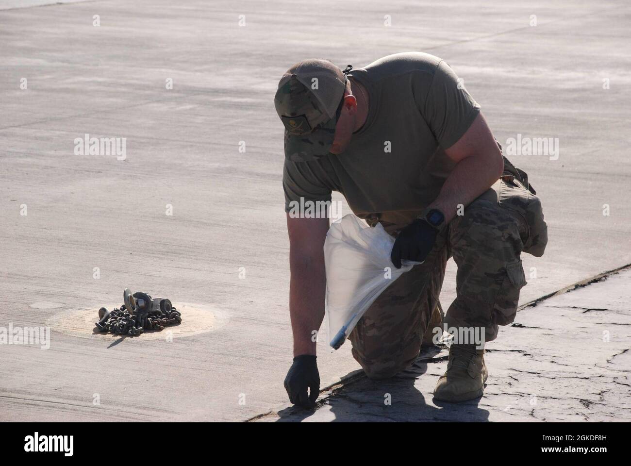 U.S. Soldiers with the 28th Expeditionary Combat Aviation Brigade clean ...
