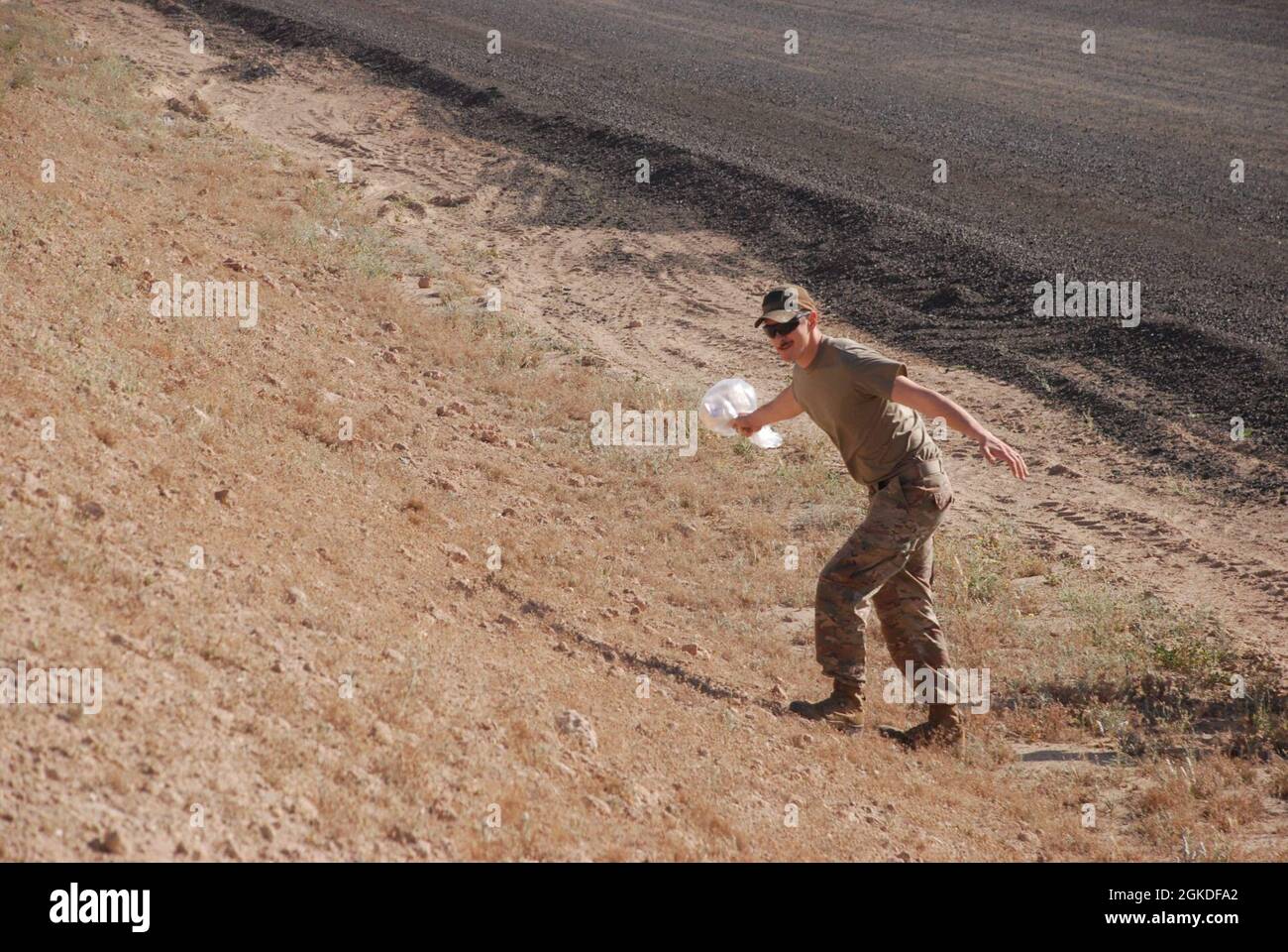 U.S. Soldiers with the 28th Expeditionary Combat Aviation Brigade clean ...