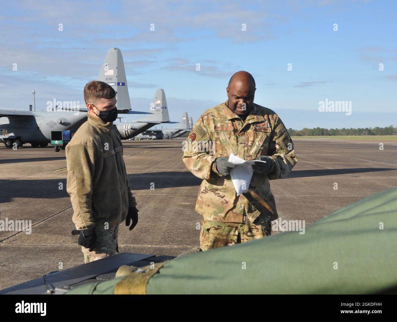 Master Sgt. Neil Moore, an aerial porter with the 25th Aerial Port ...