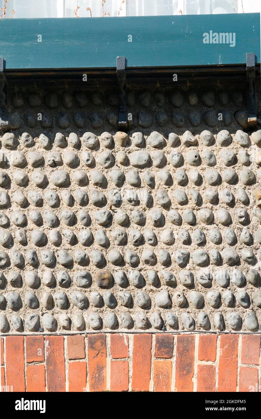Rottingdean House with walls of round cobbles in render / traditional ...