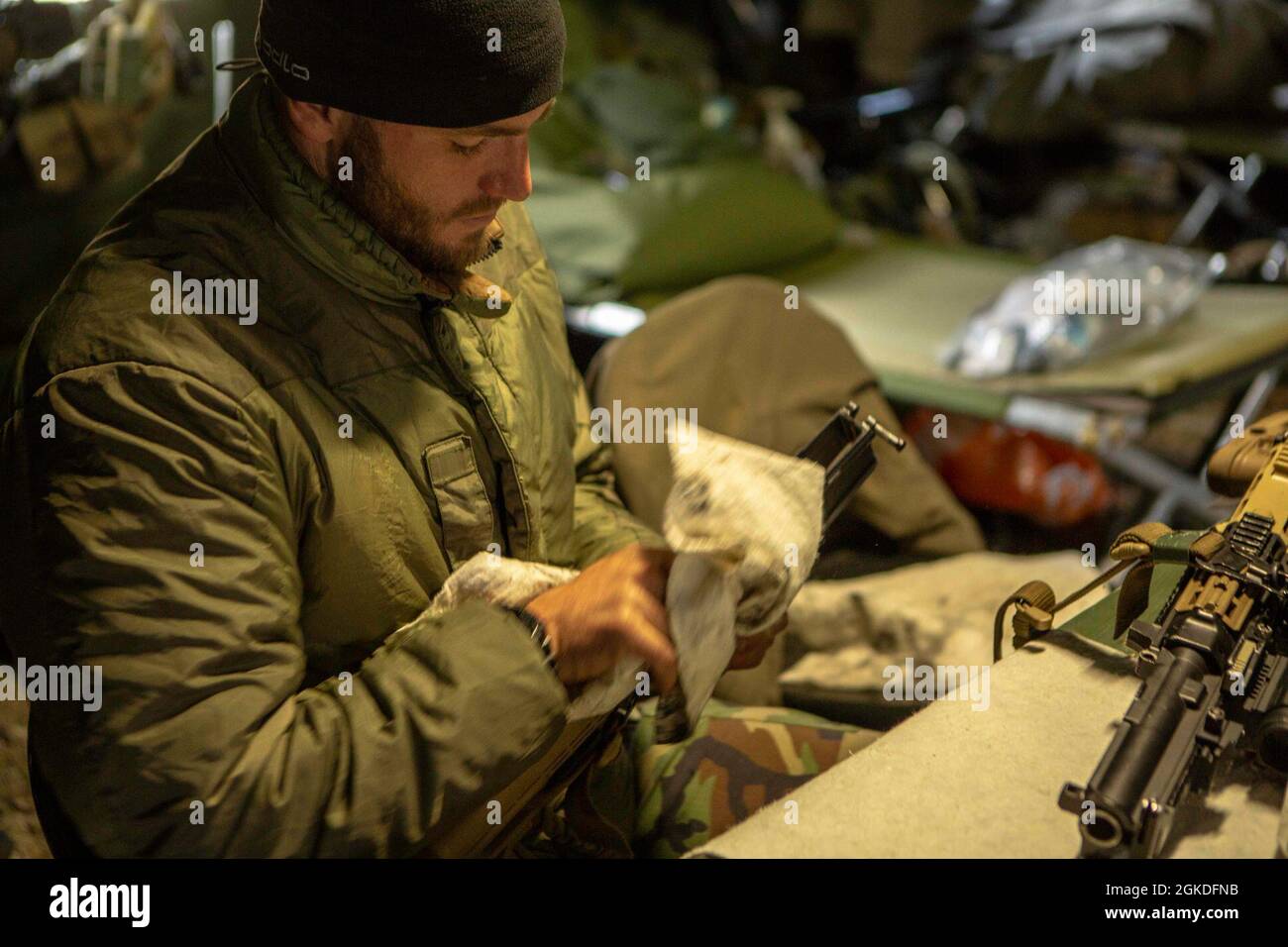 Dutch Marine Cpl. Lemmy with 32nd Raiding Squadron cleans the lower ...