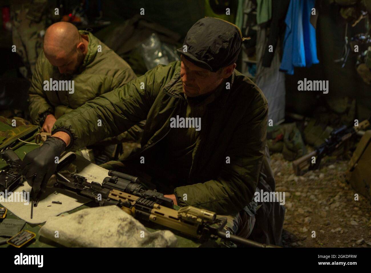 Dutch Marine Cpl. Gavin with 32nd Raiding Squadron cleans his Colt ...