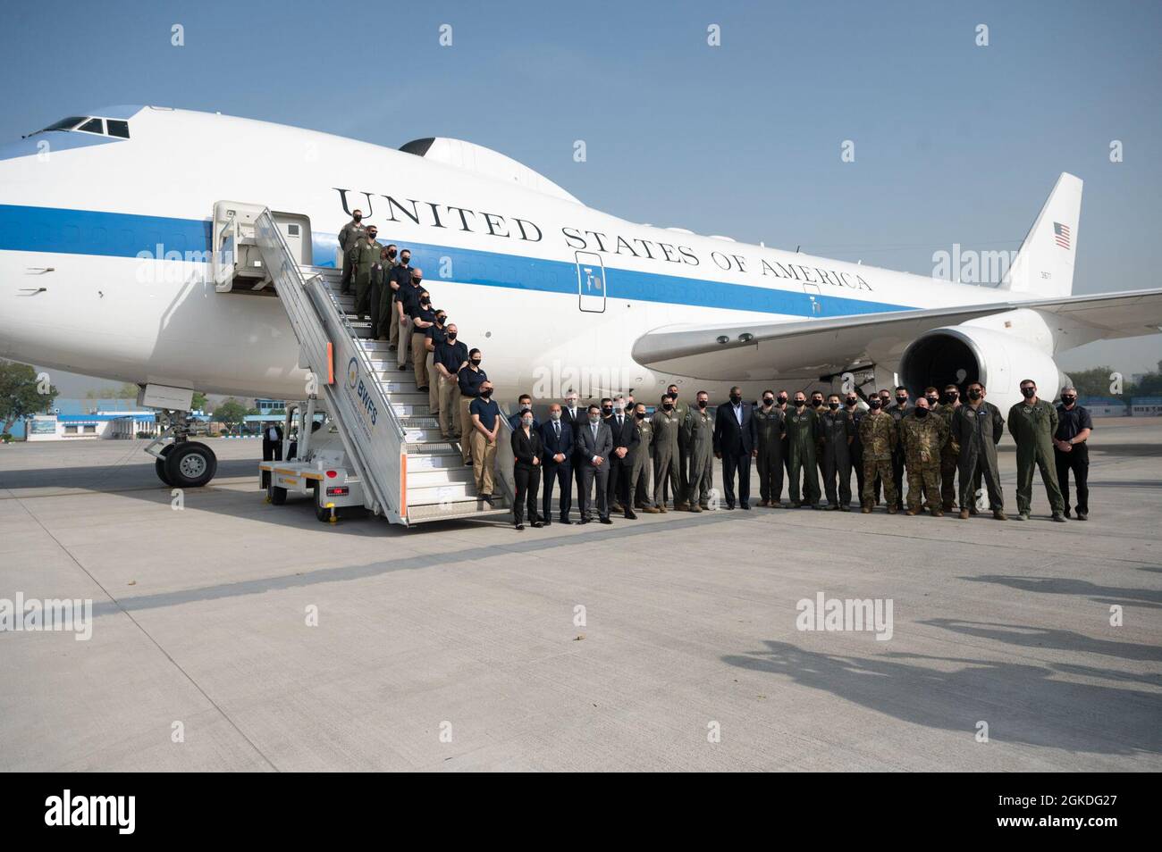 Secretary of Defense Lloyd J. Austin III poses in front of the E-4B ...