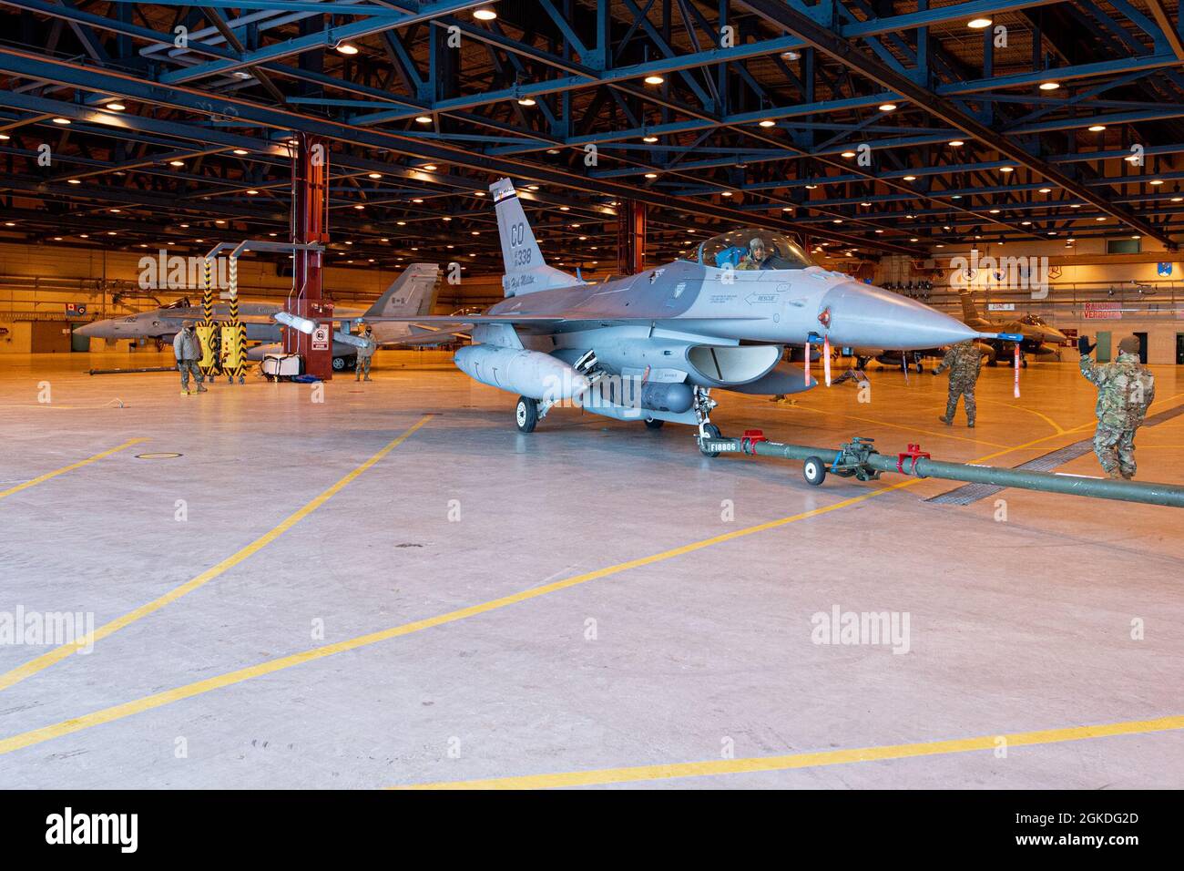 Canadian F-18’s and American F-16 Fighter Jets are housed together in a ...