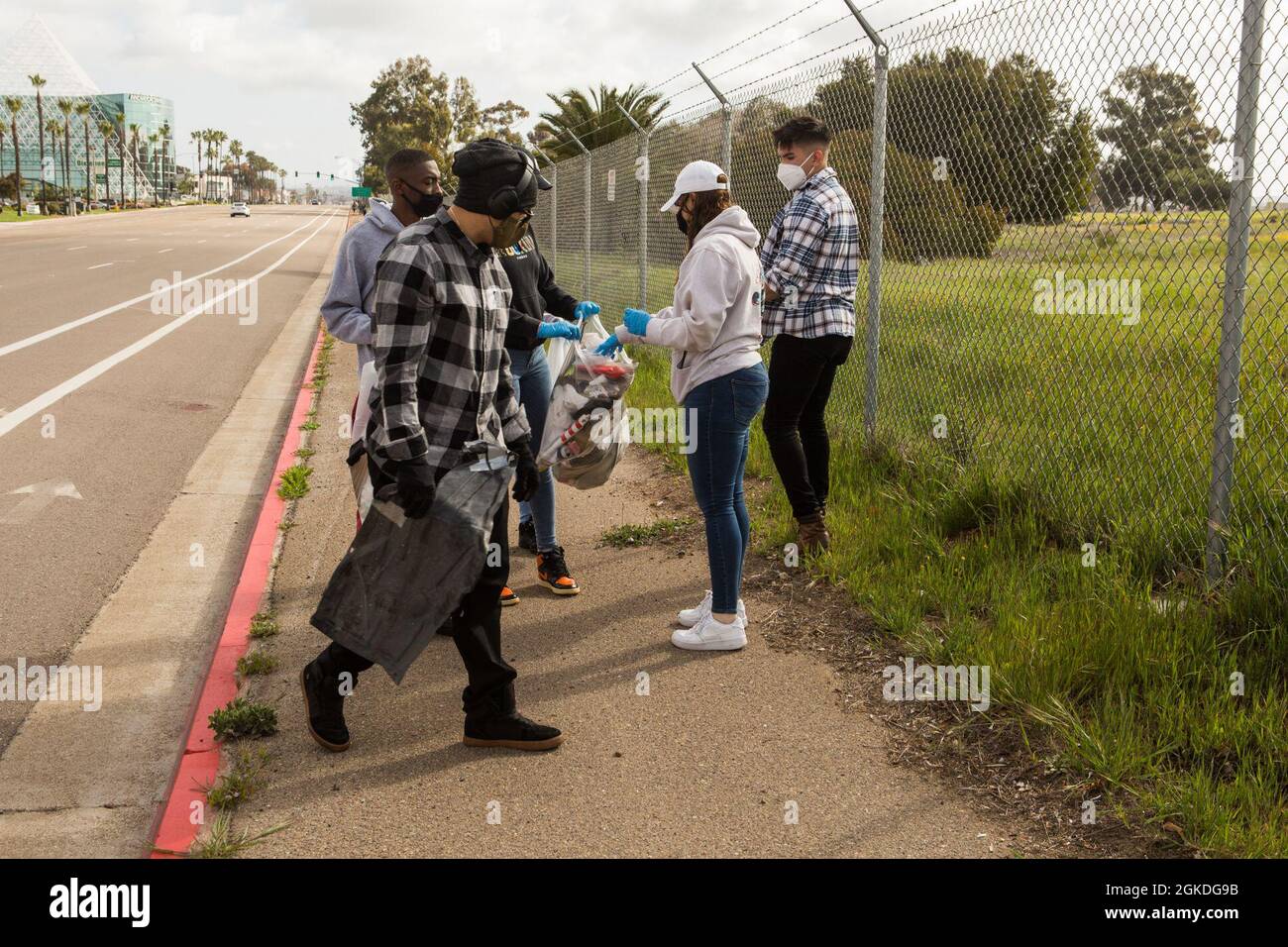 U.S. Marines volunteering for the Single Marine Program help each other ...