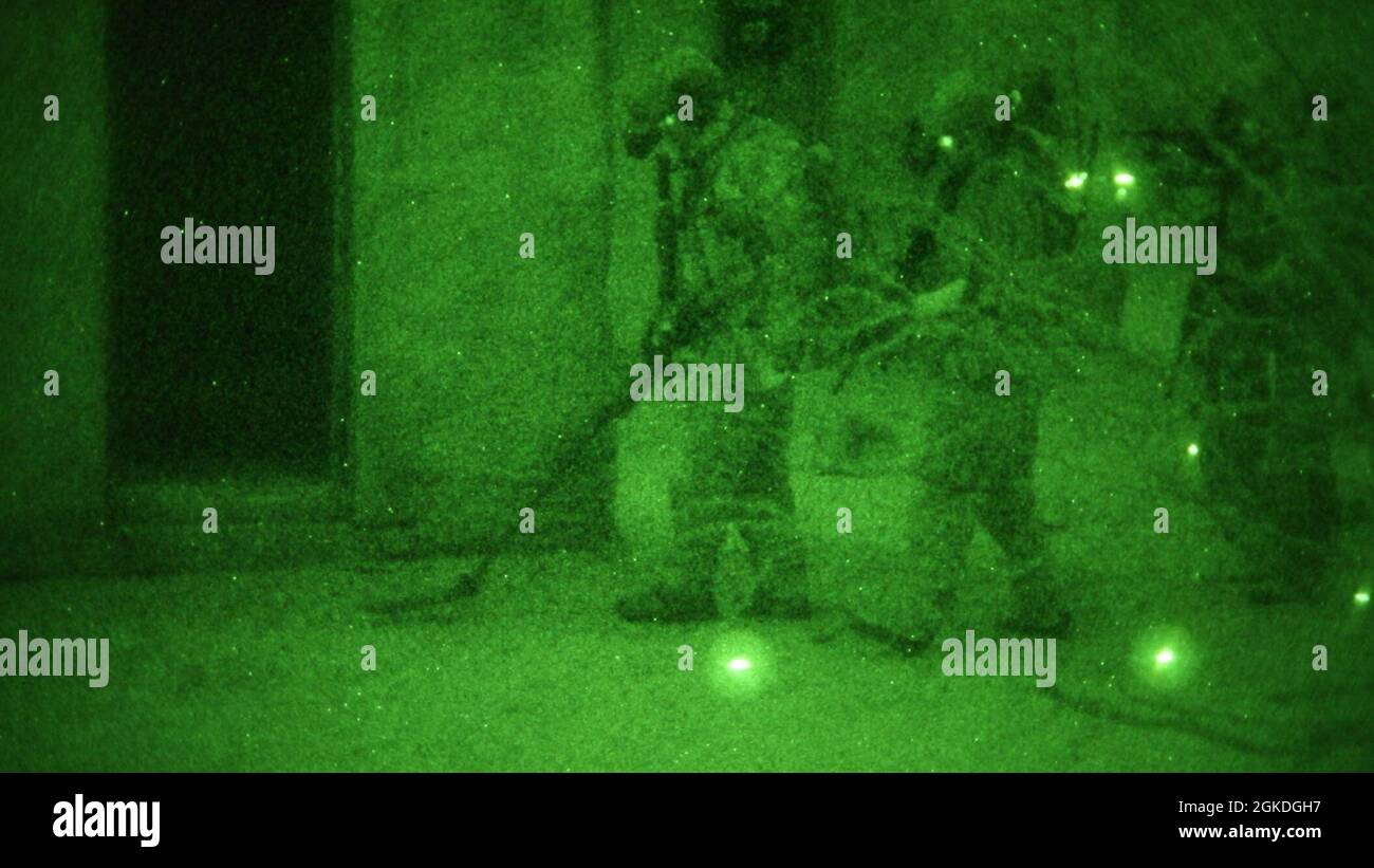 U.S. Army EOD Technician from 53rd Ordnance Company (EOD) clears a path ...