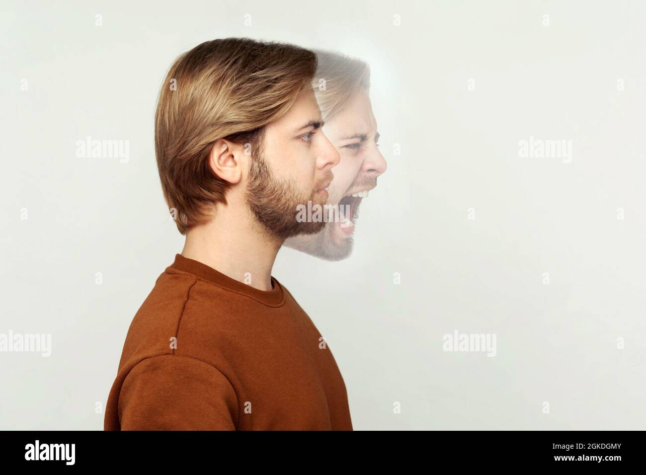 Profile side view portrait of two faced bearded man in calm serious and ...