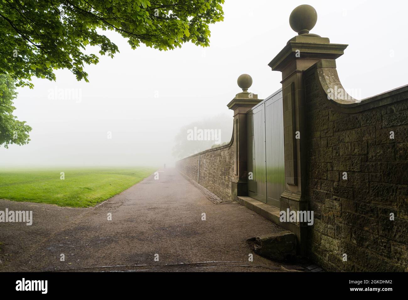 The back gate of Holyrood Palace with the haar(fog) coming in from the ...