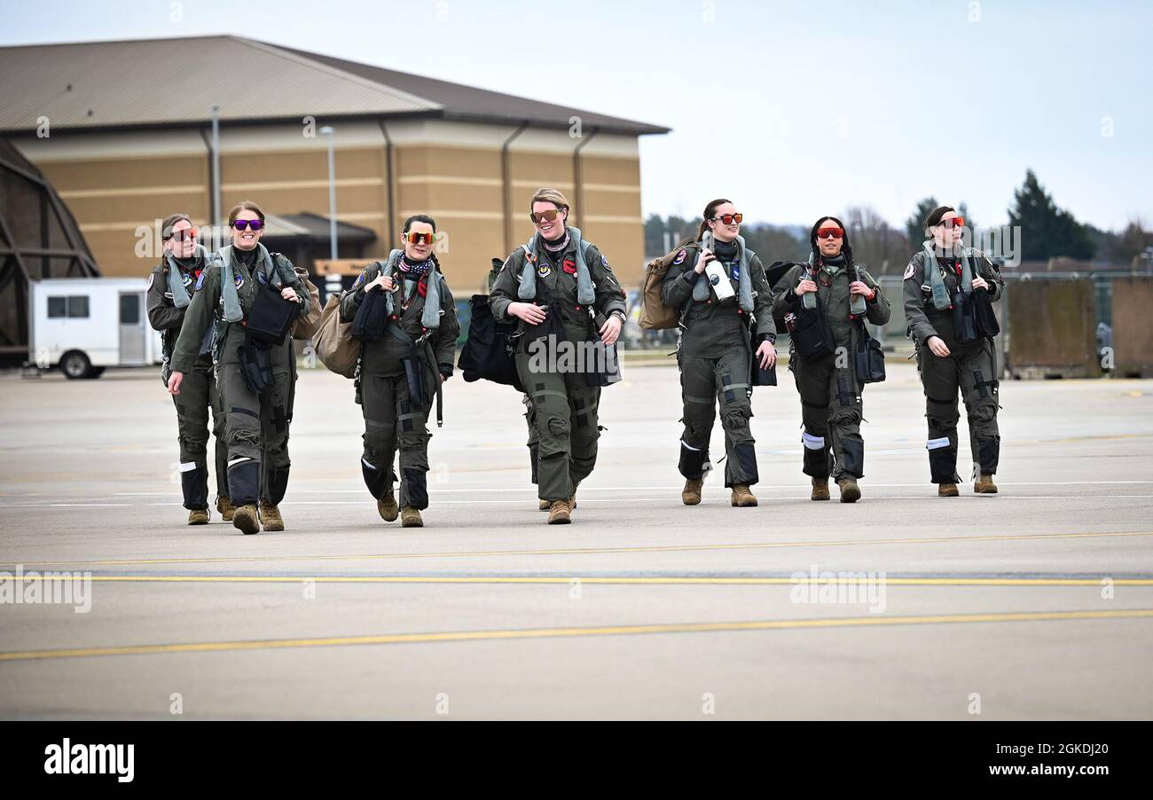 An all-women F-15E Strike Eagle aircrew steps to the flightline in ...