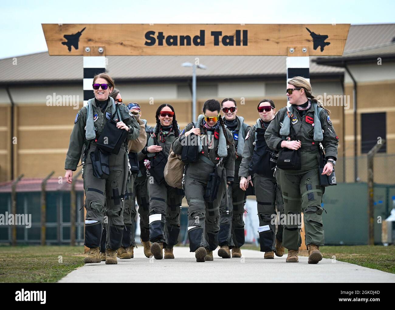 An all-women F-15E Strike Eagle aircrew steps to the flightline in ...