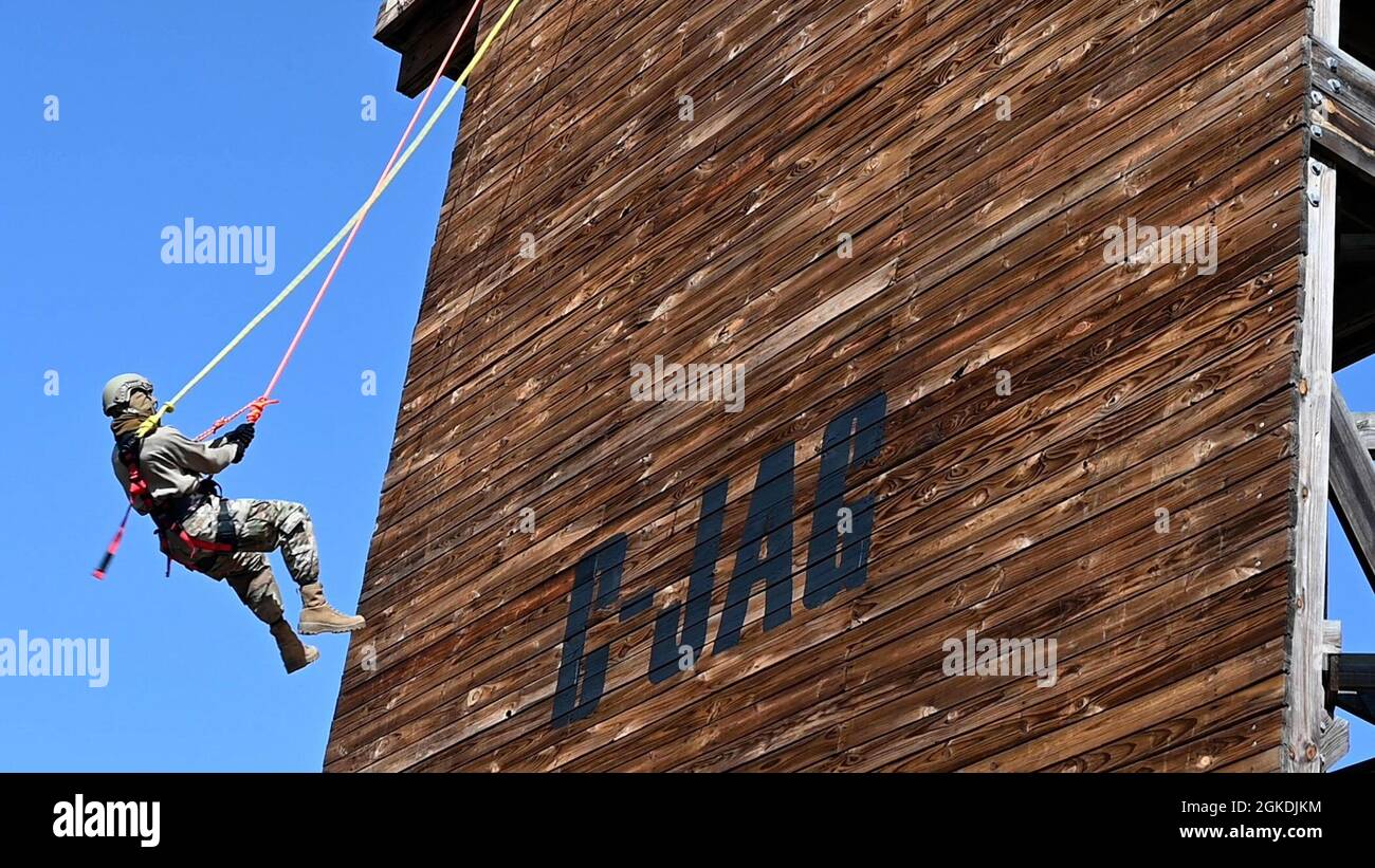 A member of the 910th Security Forces Squadron rappels down a wall at ...