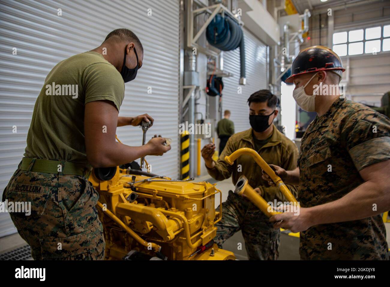 U.S. Marine Cpl. Ja’kove McCullum, left, a motor transport welder, Cpl ...