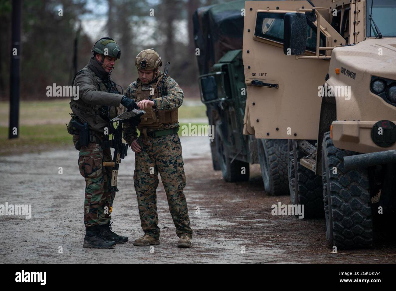 A Dutch Marine with 32nd Raiding Squadron, left, and U.S. Marine Corps ...